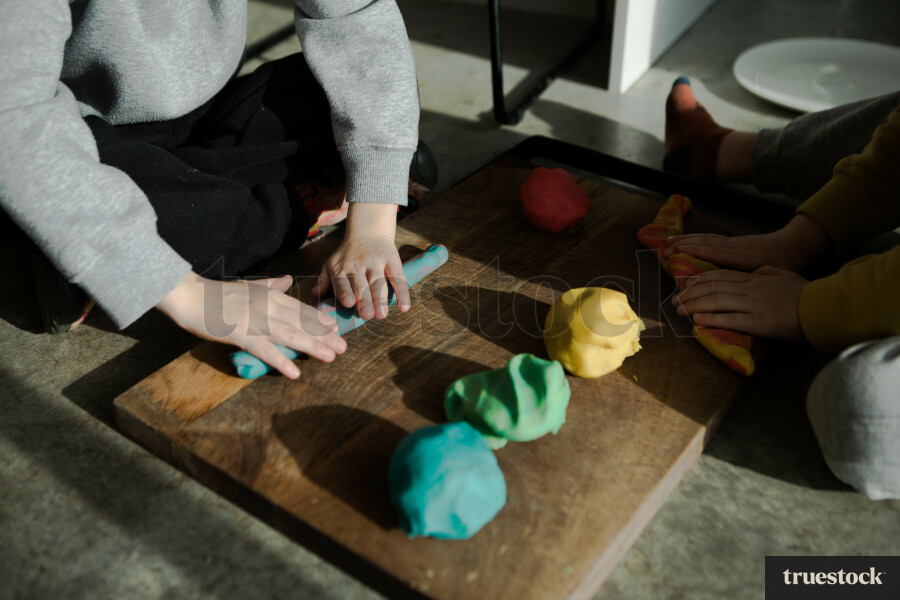 Children playing with playdough at home making shapes by Kathryn Taylor ...